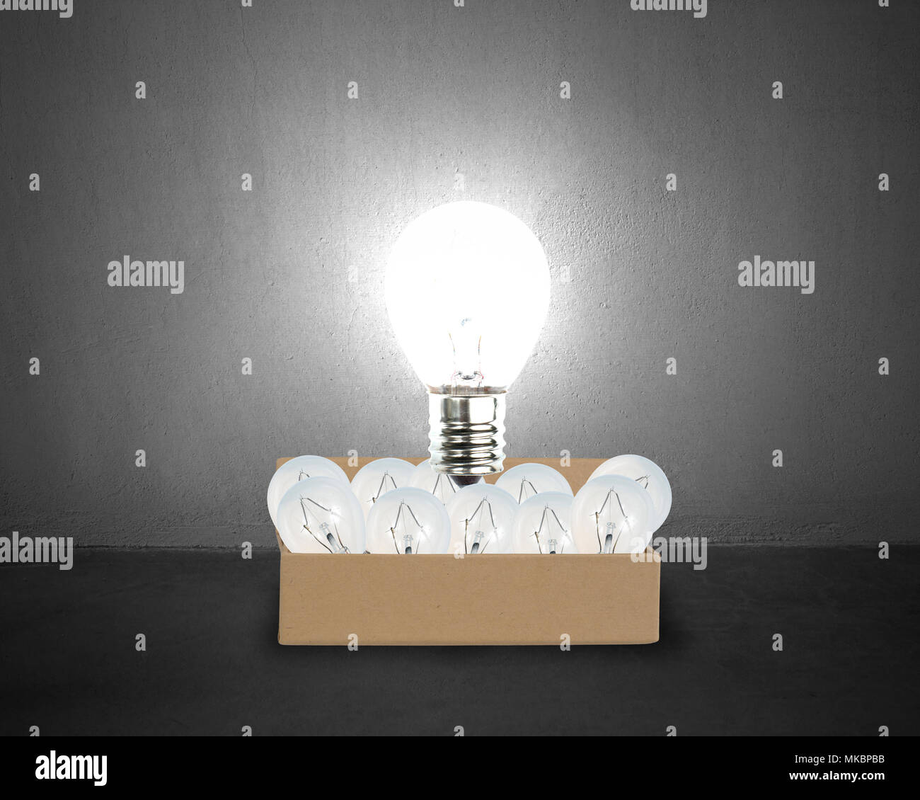 Glowing light bulb float over opened box hi-res stock photography and ...
