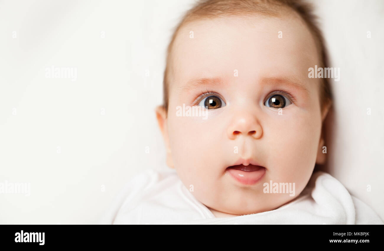 Beautiful small baby face, portrait. Curious little child Stock Photo ...
