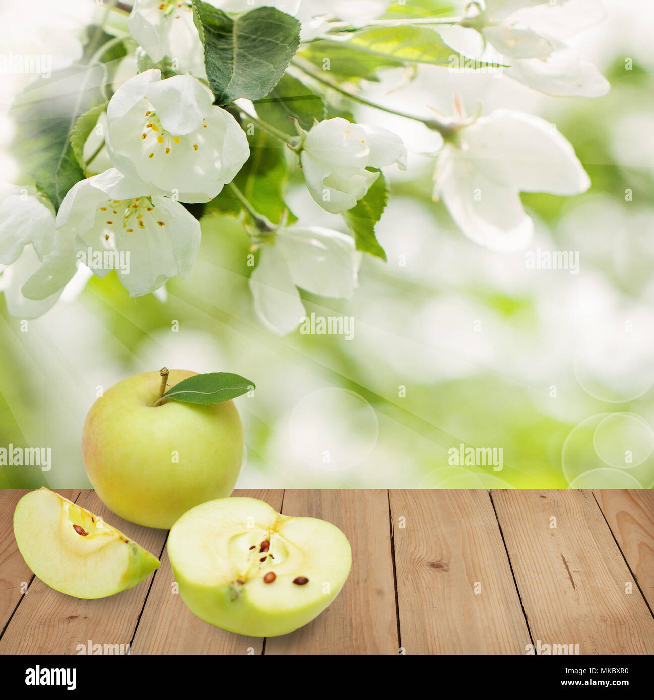 Green Apple Fruits with Leaves and Flowers on Rustic Wood Background ...