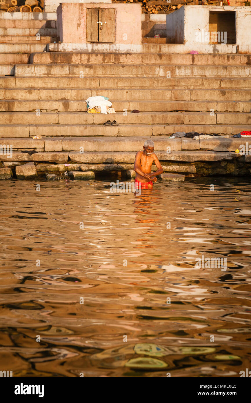 Every morning thousands of Hindus religiously wash themselves along the ...