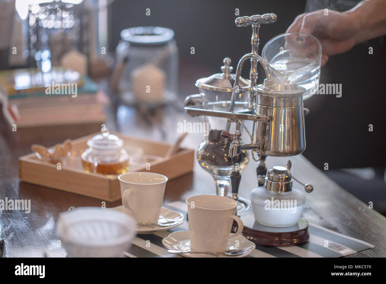 close up of siphon vacuum, coffee cup and siphon vacuum coffee maker at ...