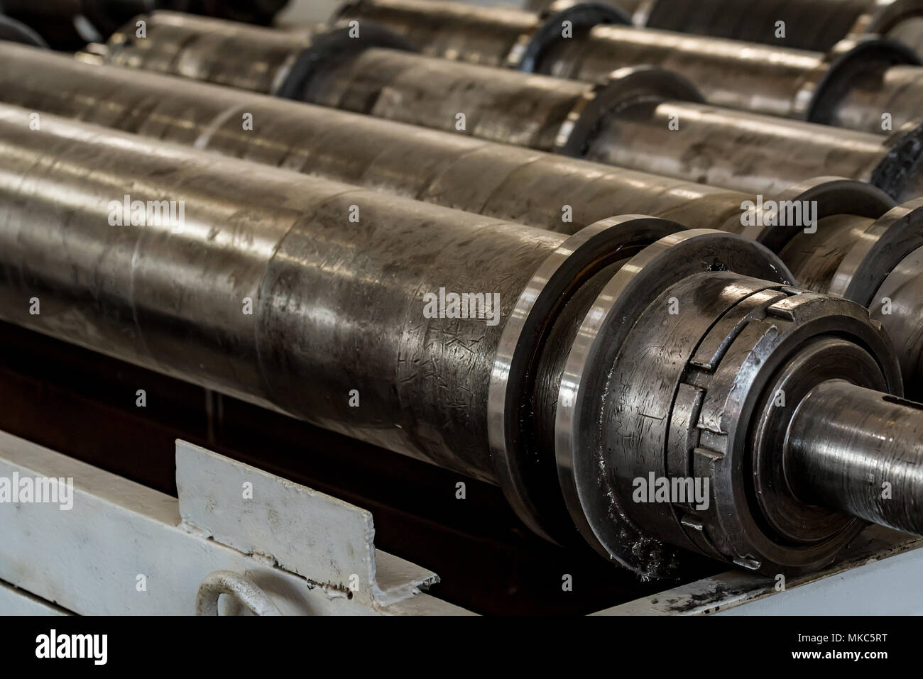 Drive shafts in factory close Stock Photo - Alamy