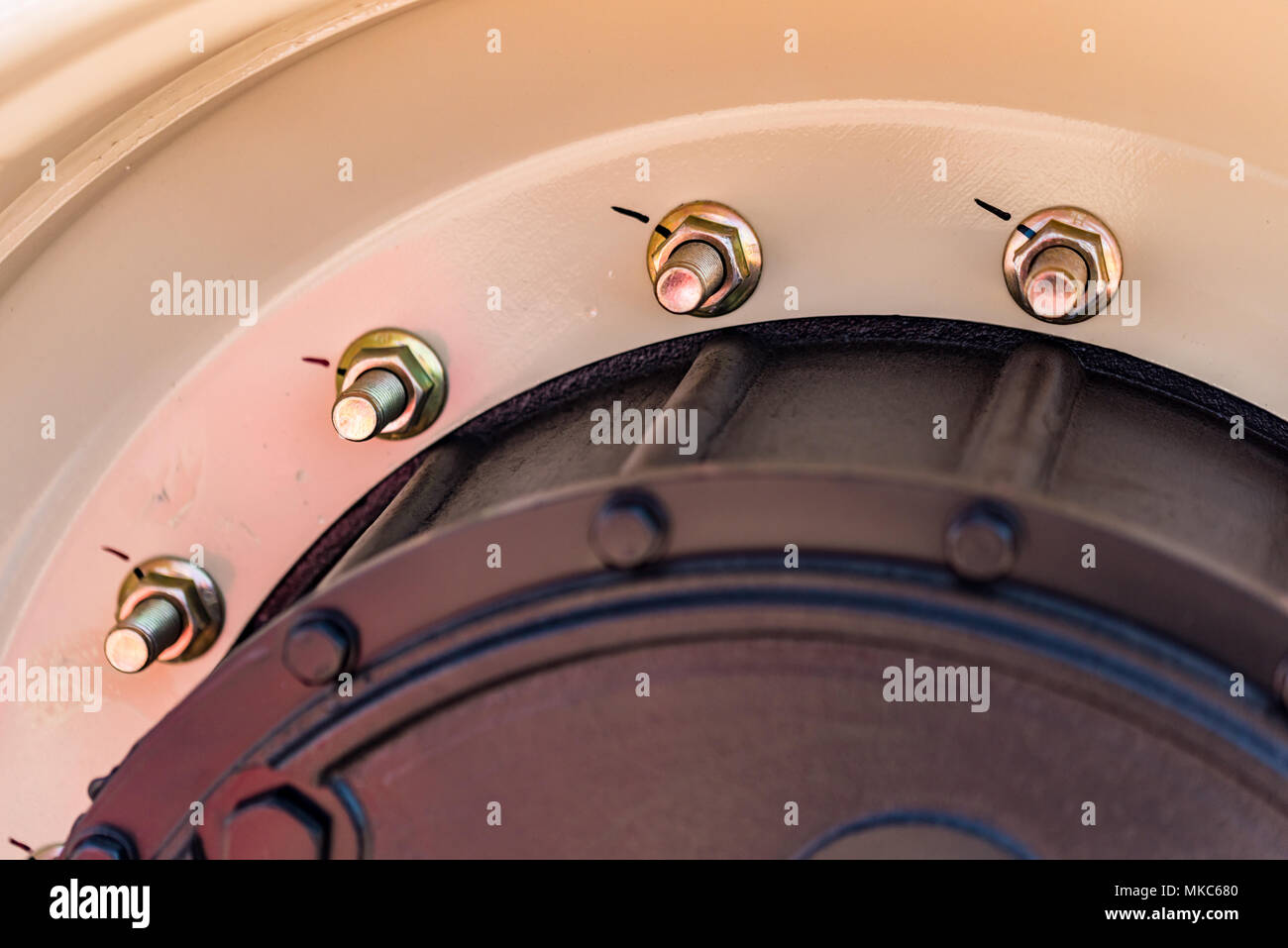 Wheel hub of modern heavy tractor close Stock Photo - Alamy