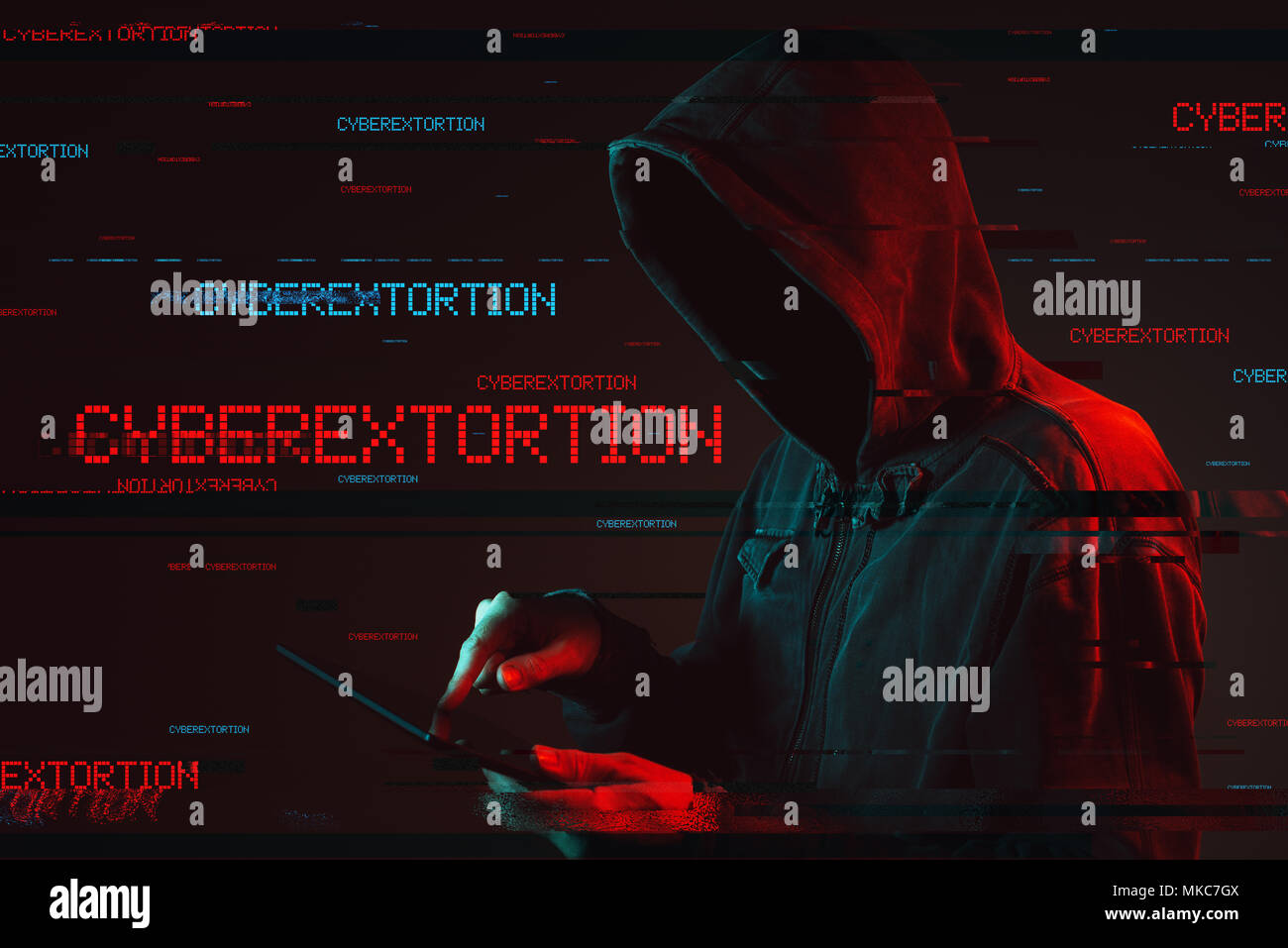 Cyberextortion concept with faceless hooded male person using tablet ...