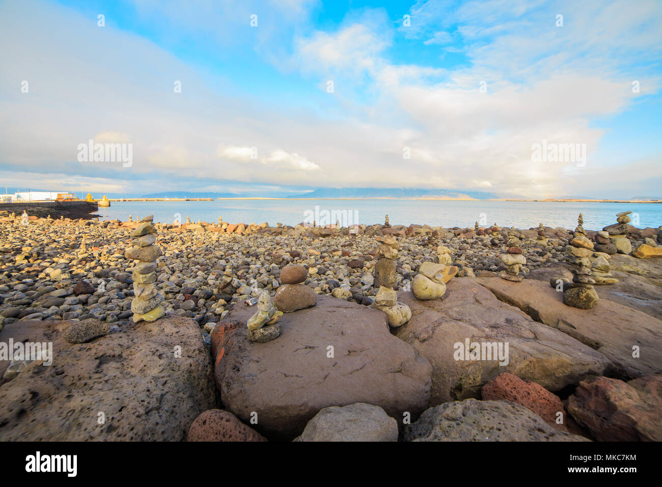 Series of stacked rock columns called cairns facing the sea in ...