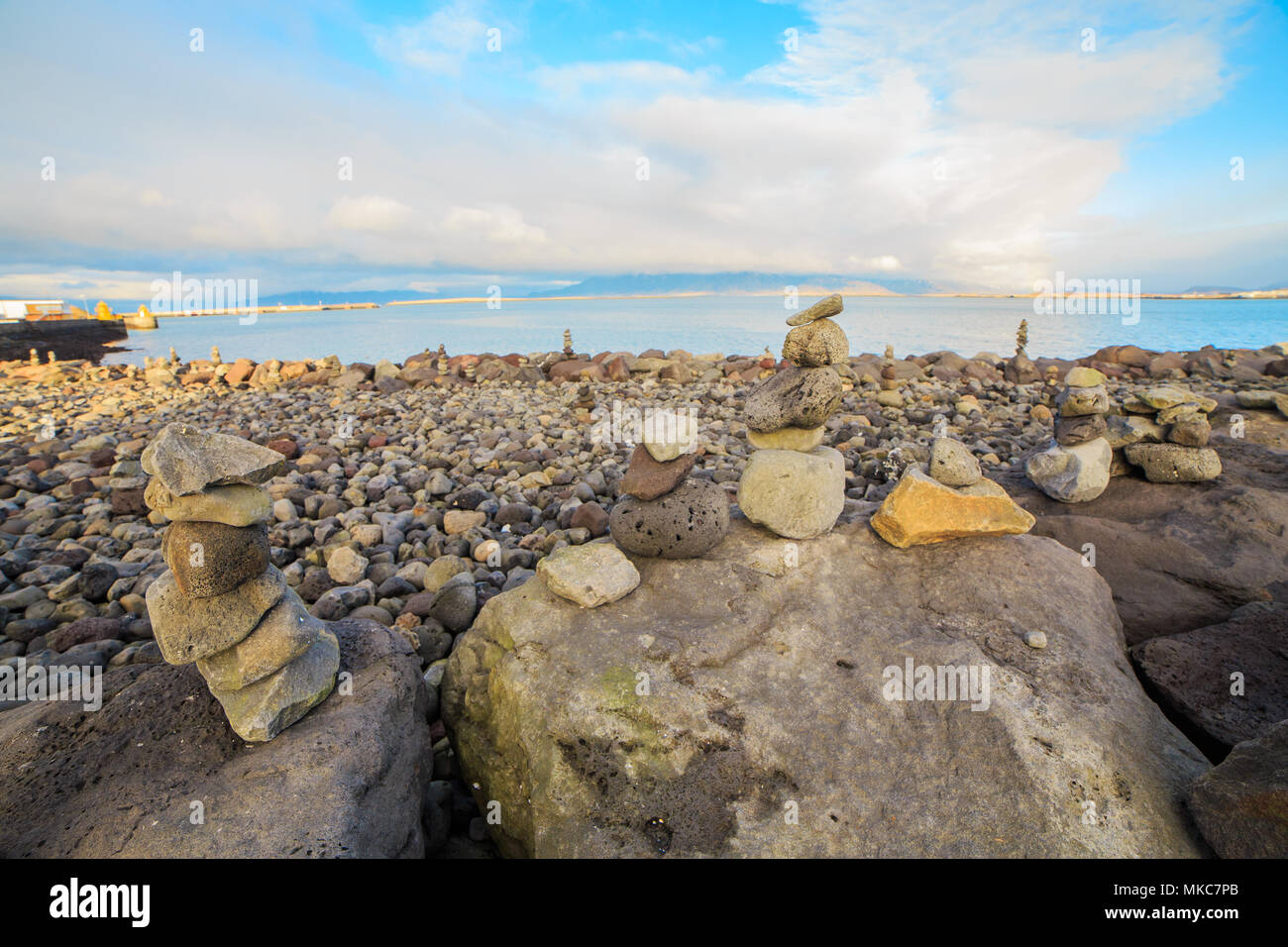 Series of stacked rock columns called cairns facing the sea in ...