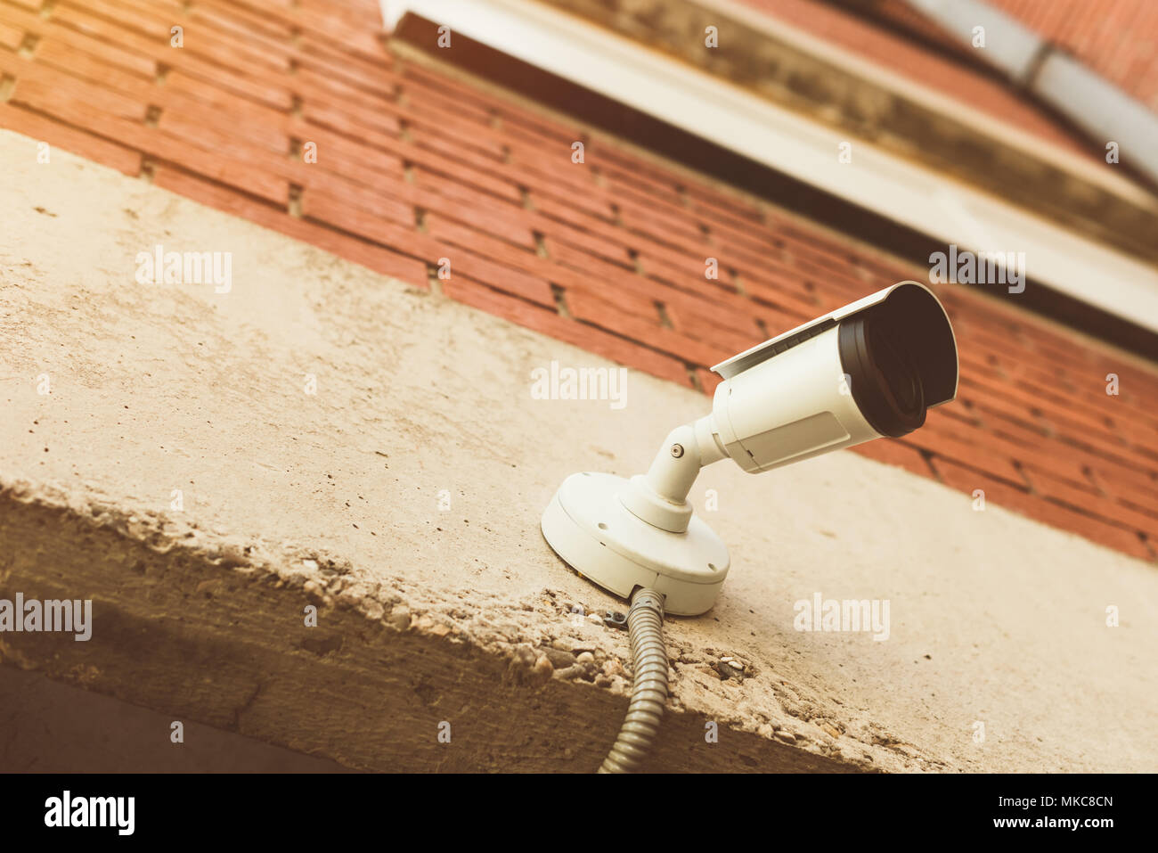 Home protection security camera mounted on house exterior wall for ...