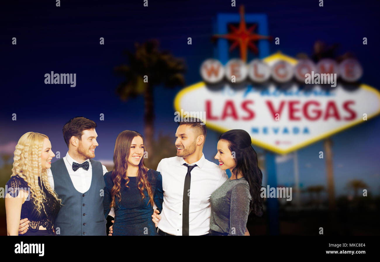 friends in party clothes hugging at las vegas Stock Photo - Alamy