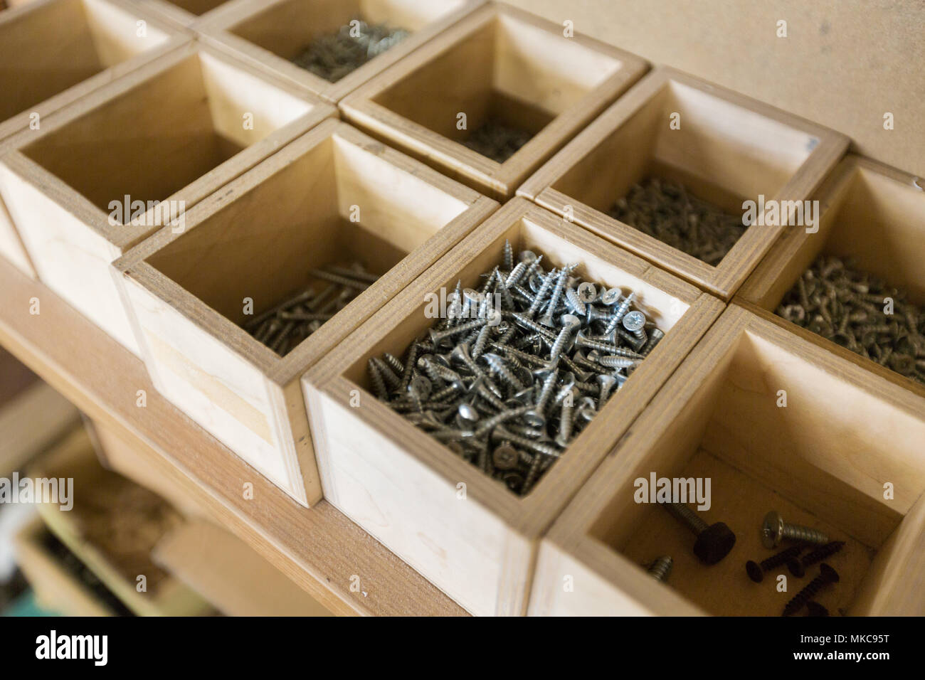 screws in wooden boxes at workshop Stock Photo - Alamy