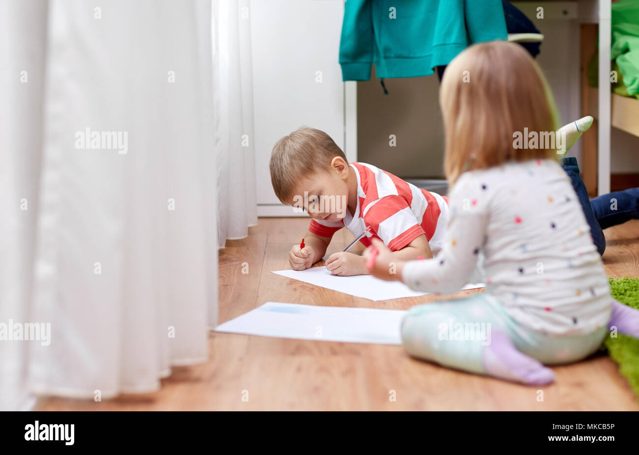happy kids drawing at home Stock Photo - Alamy