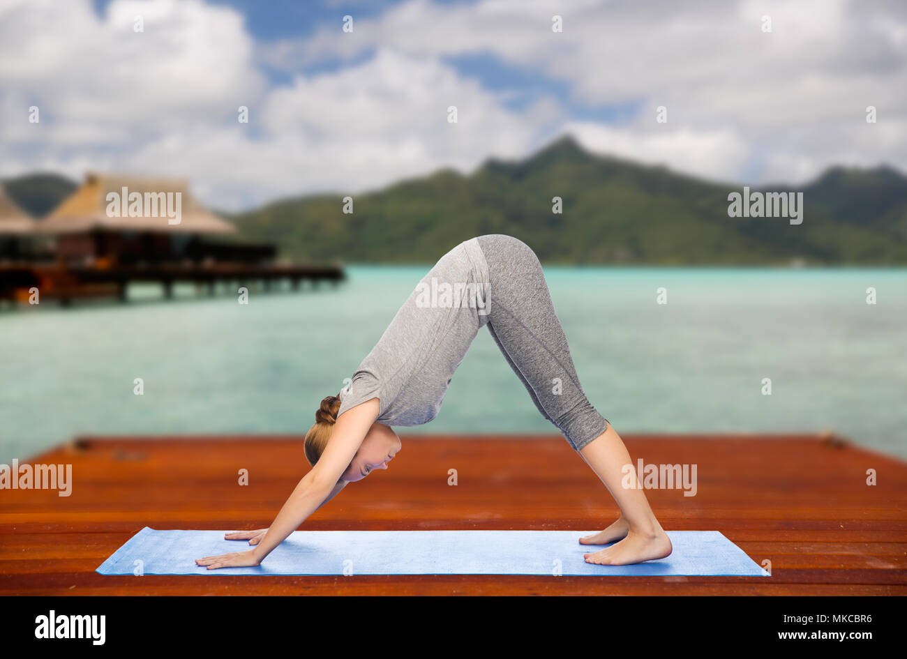 Woman making yoga dog hi-res stock photography and images - Alamy