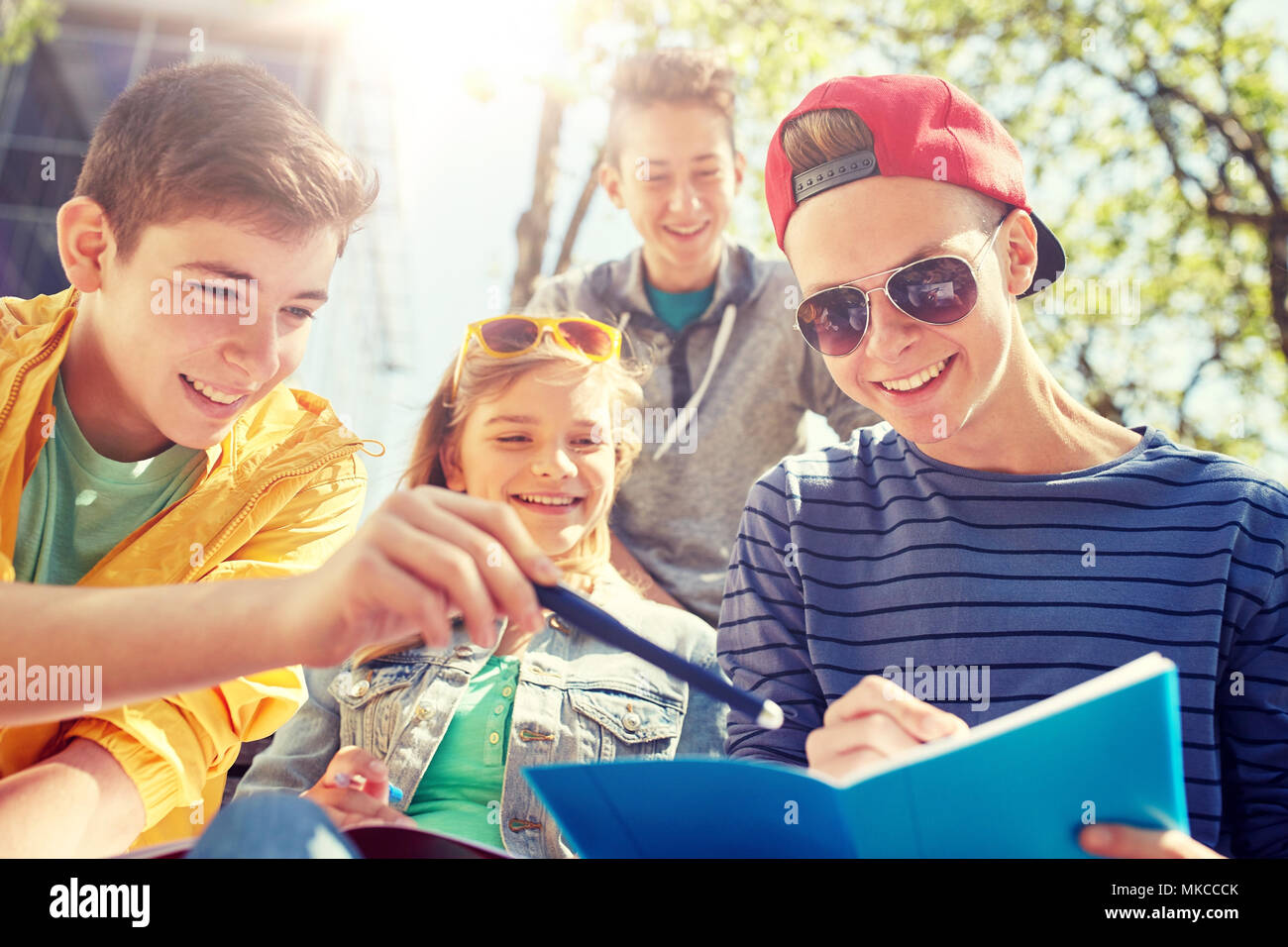 group of students with notebooks at school yard Stock Photo - Alamy