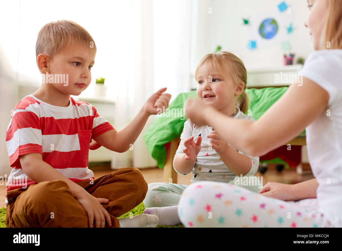 kids playing rock-paper-scissors game at home Stock Photo - Alamy