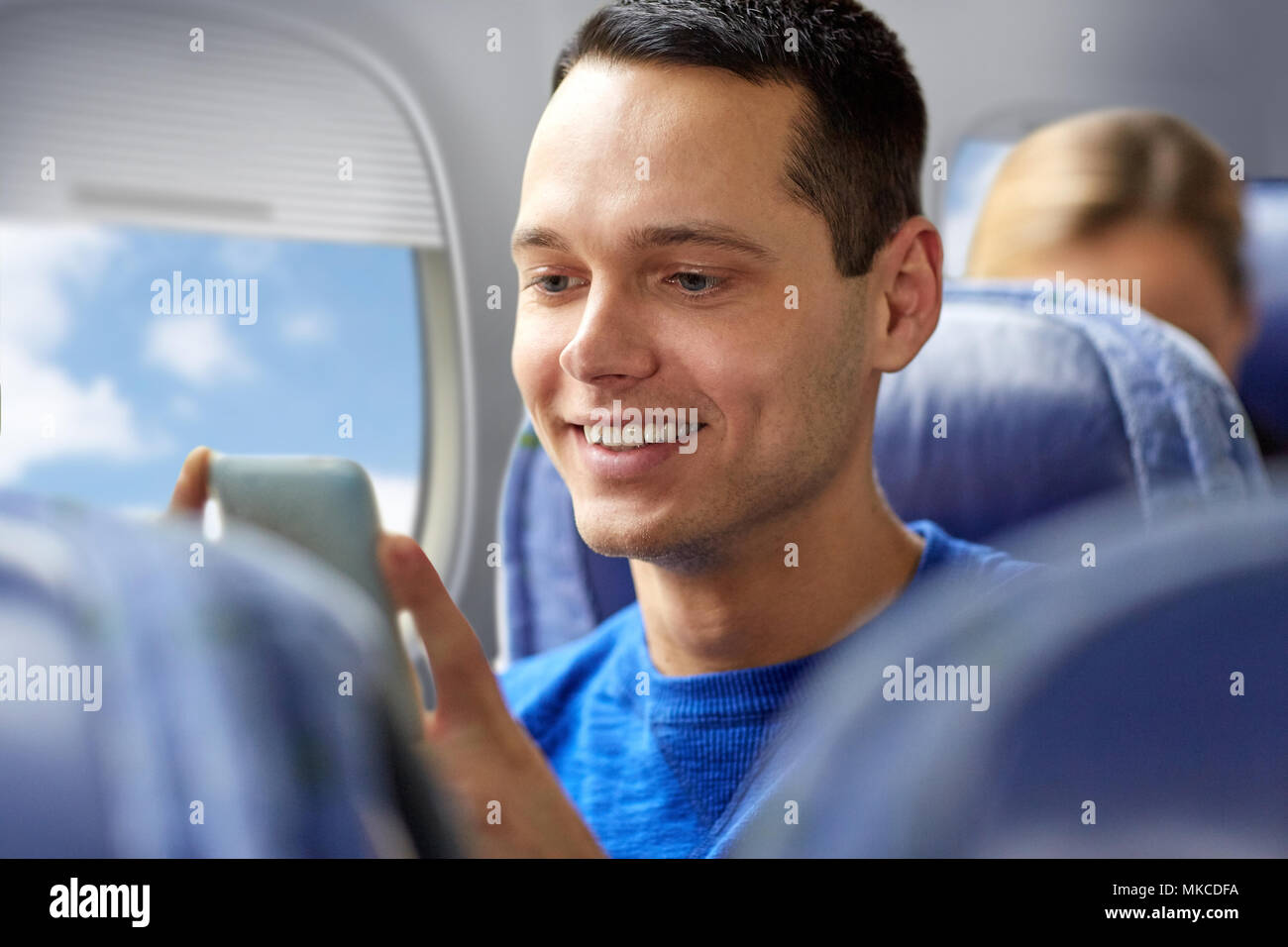 Male tourist sitting in airplane hi-res stock photography and images ...