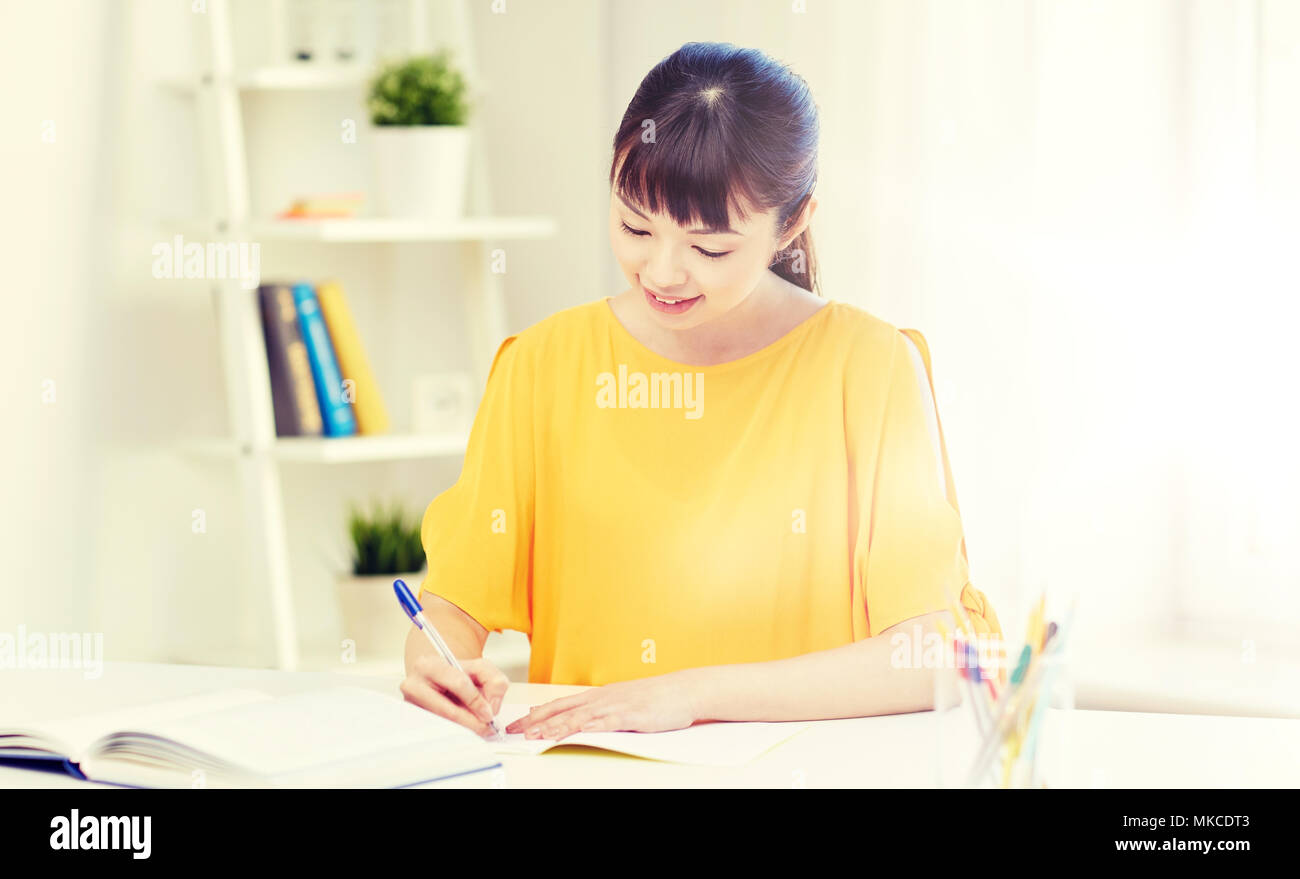 happy asian young woman student learning at home Stock Photo - Alamy