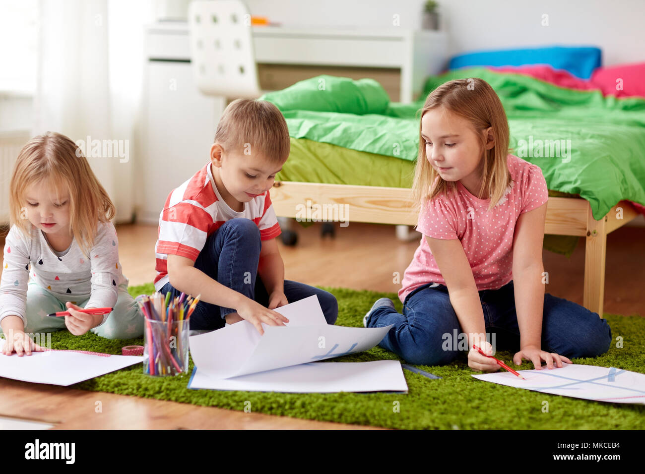 happy creative kids drawing at home Stock Photo - Alamy