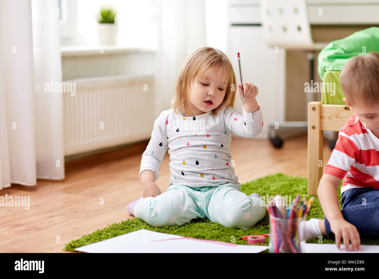 happy kids drawing at home Stock Photo - Alamy