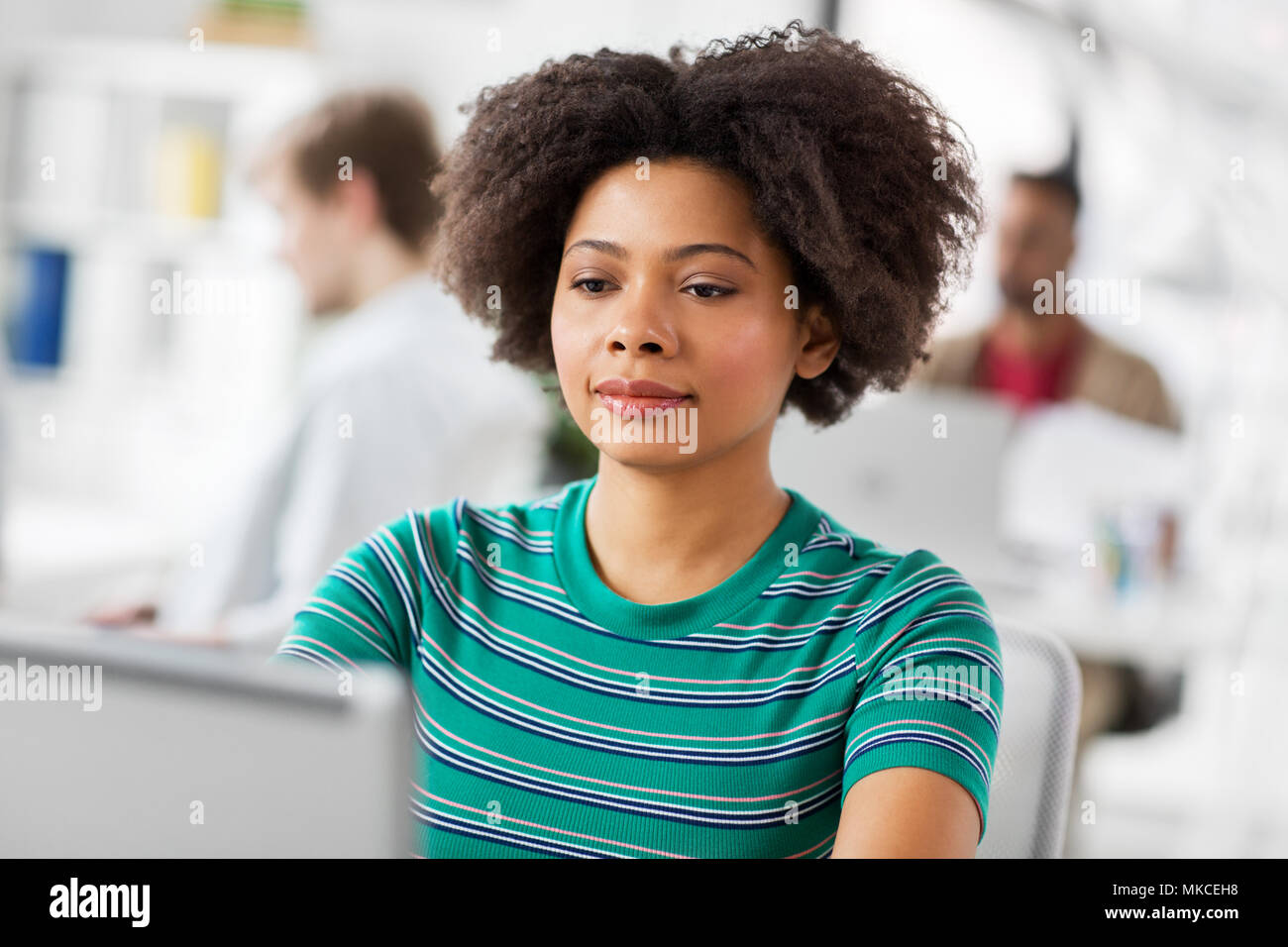 african woman with laptop computer at office Stock Photo - Alamy