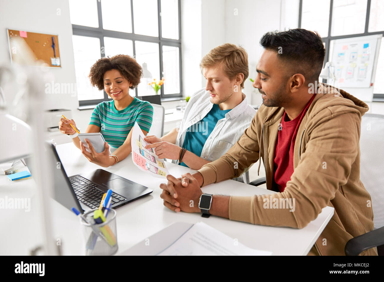 creative office workers discussing user interface Stock Photo - Alamy
