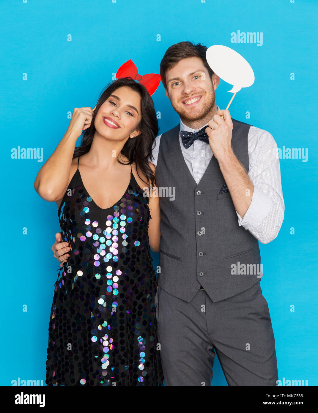 happy couple with party props having fun Stock Photo - Alamy