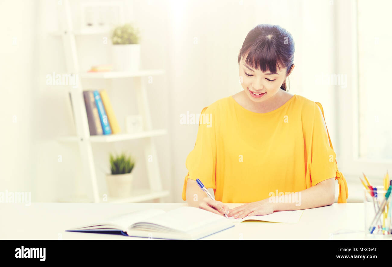 happy asian young woman student learning at home Stock Photo - Alamy