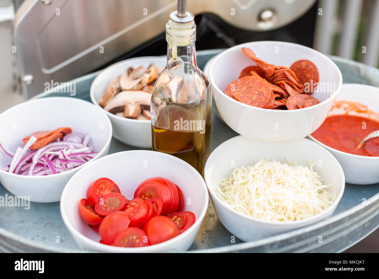 Cooking pizza on outdoor gas grill Stock Photo - Alamy