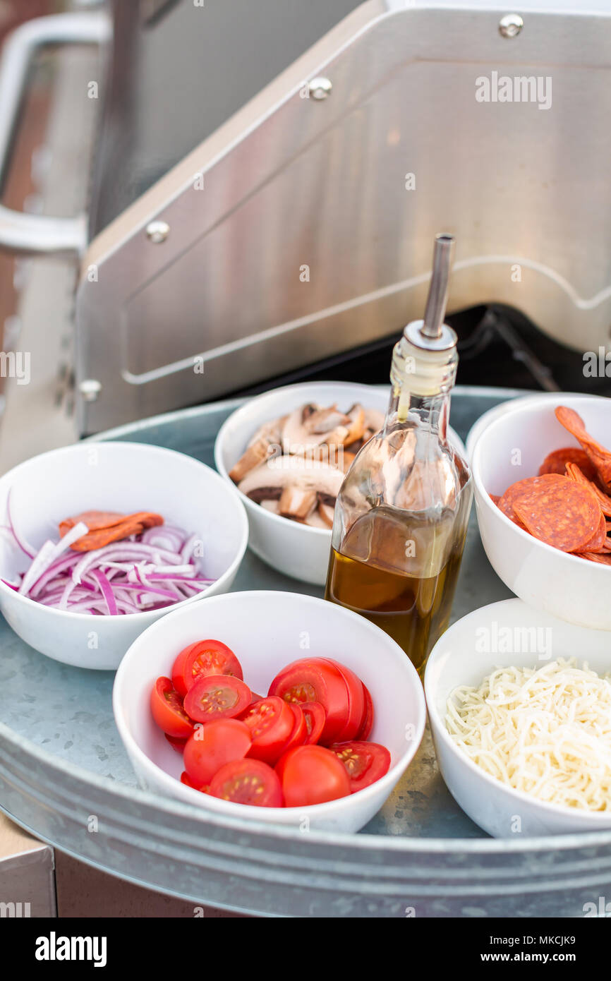 Cooking pizza on outdoor gas grill Stock Photo - Alamy