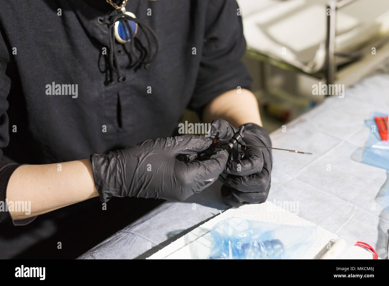 master tattoo artist prepares tools for tattooing Stock Photo - Alamy