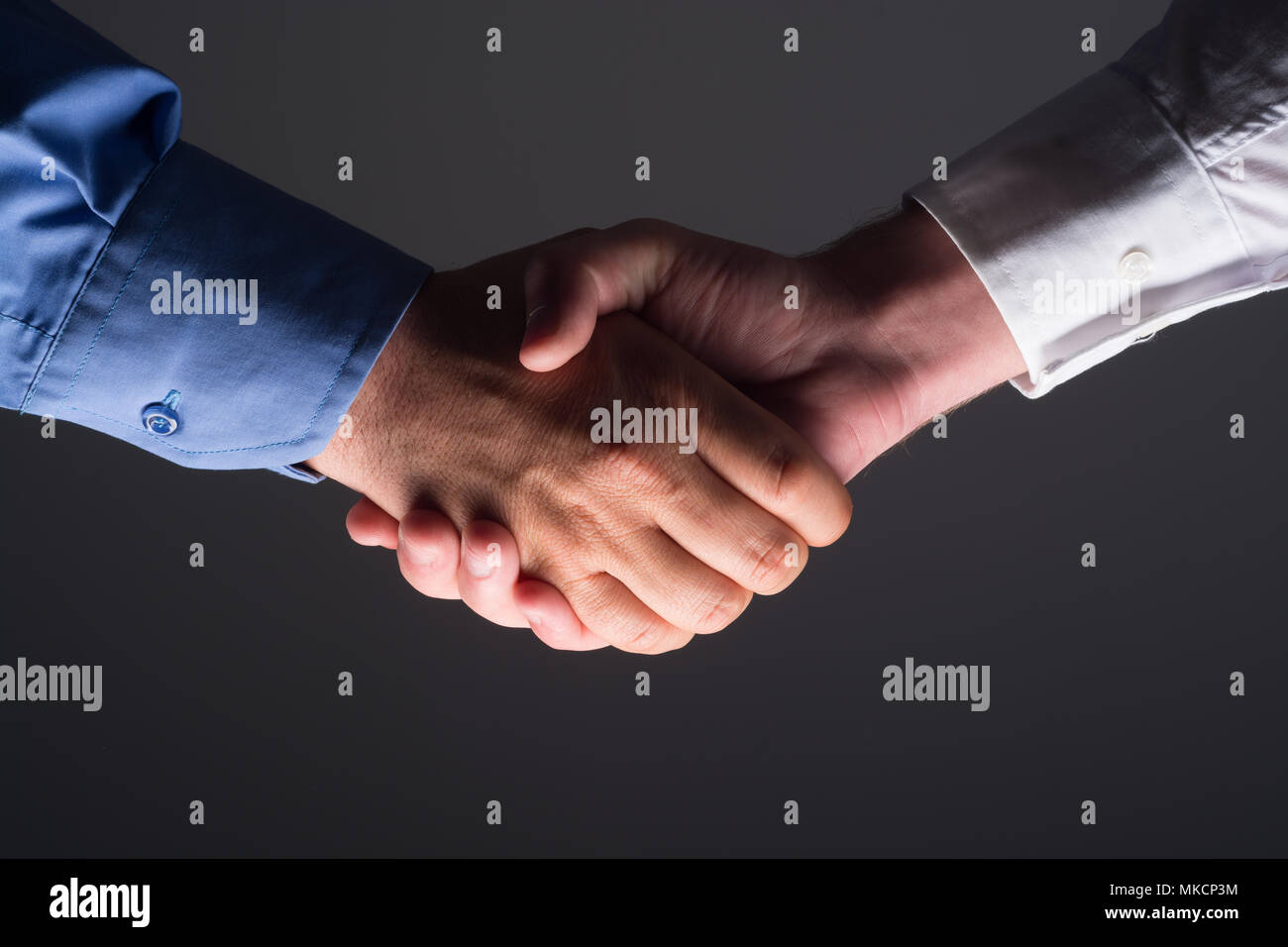 Two Businessman Handshake Handshaking between darkness and light Stock ...