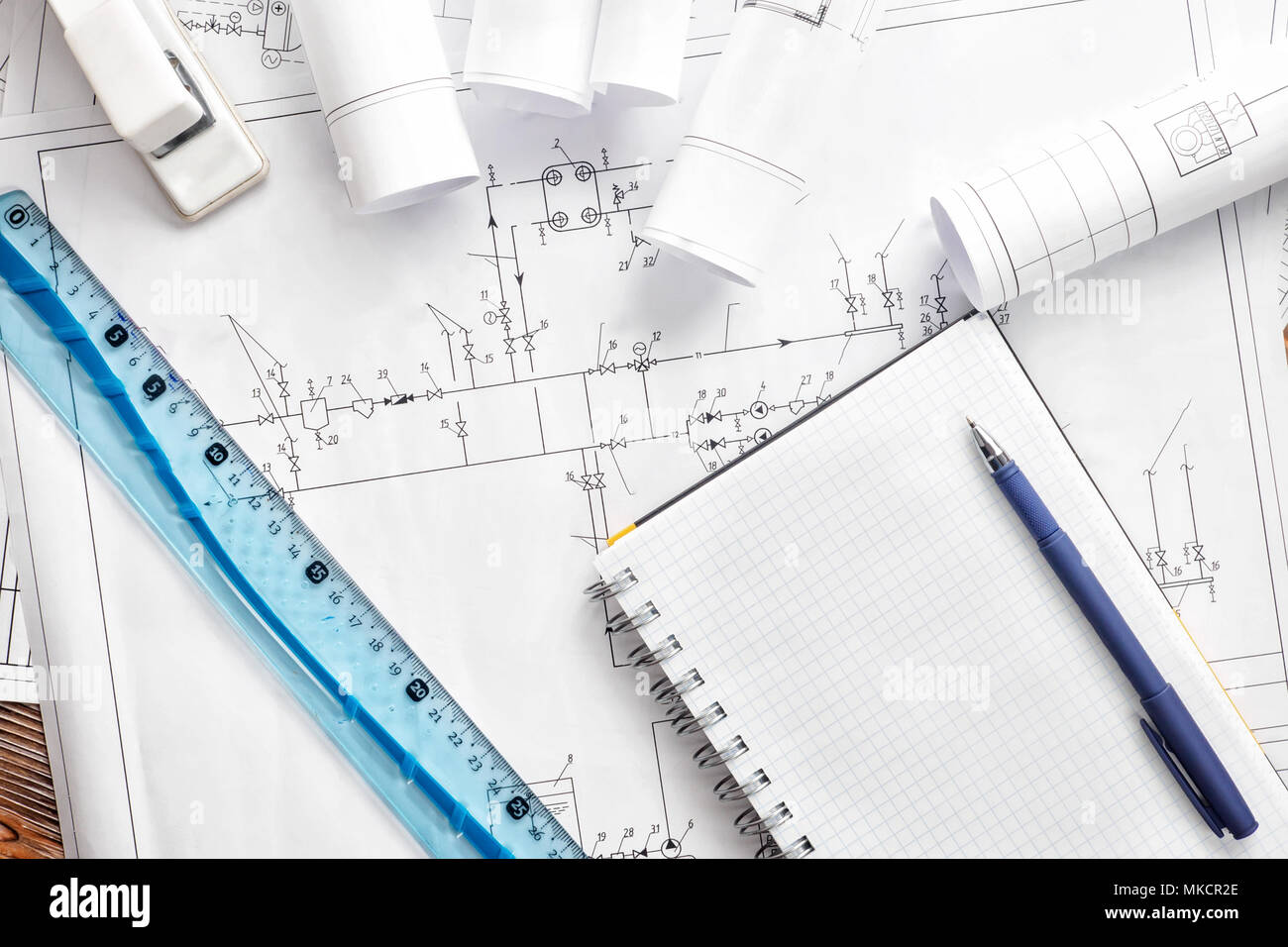 Workplace with blueprint of engineer designer Project notepad with copy ...