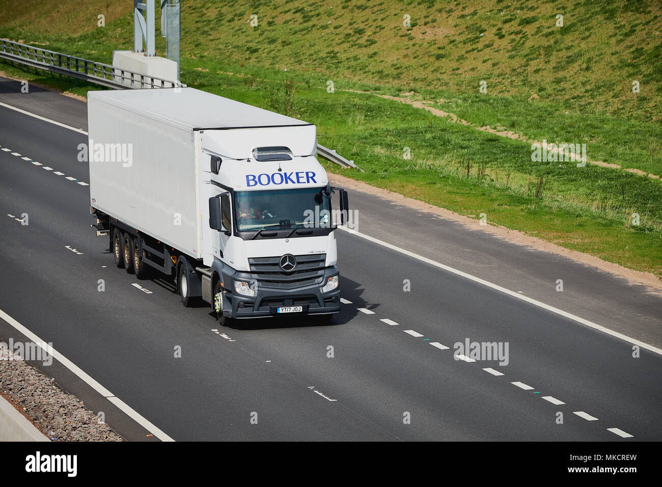 Booker Mercedes delivery trailer and lorry driving along M8 Glasgow ...