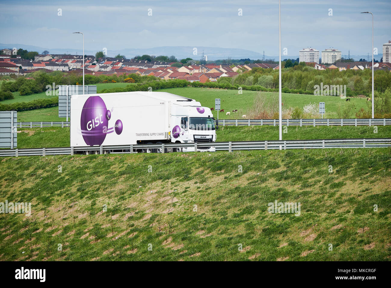 Gist delivery trailer and lorry driving along M8 Glasgow Scotland Stock ...