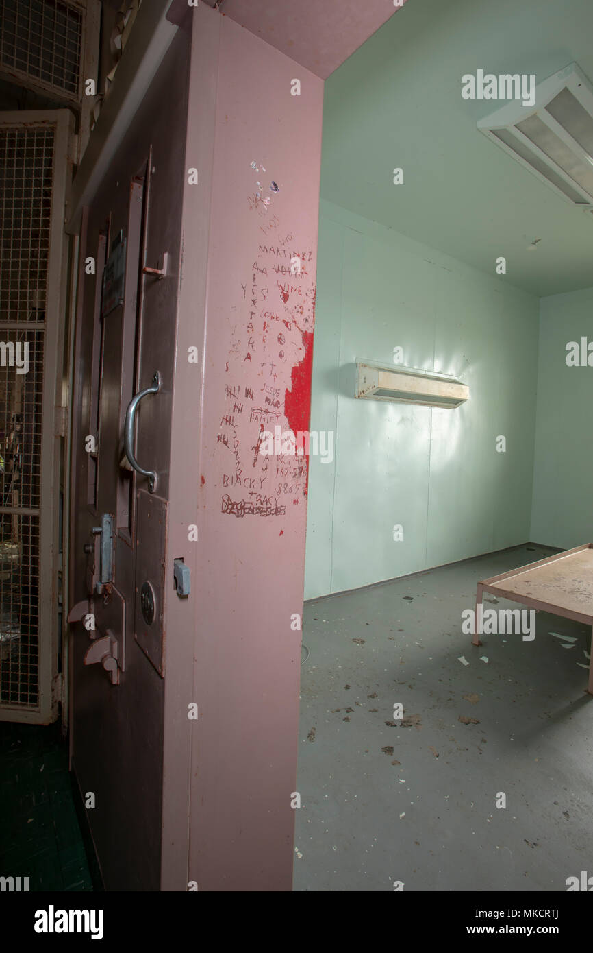 Graffiti scratched into metal frame of solitary confinement cell block ...