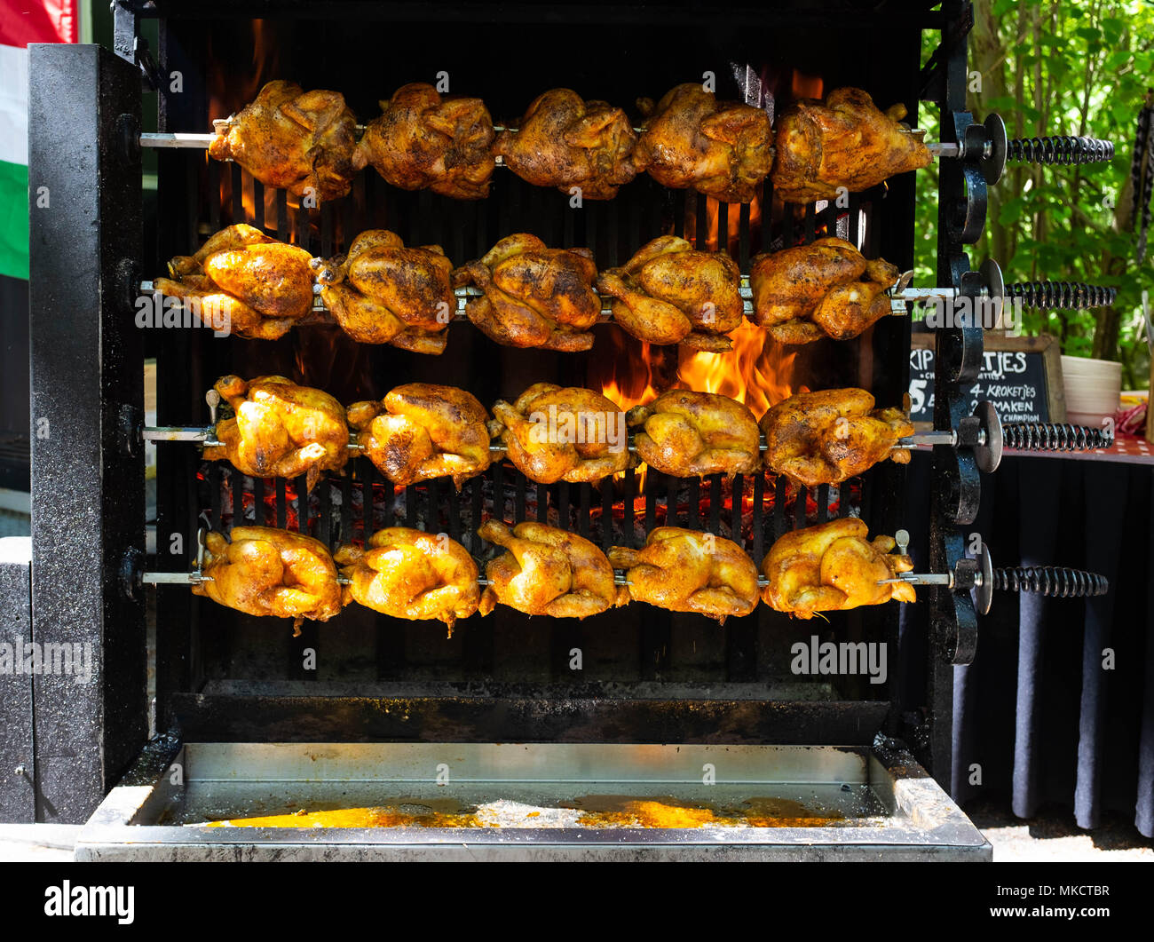 Rotisserie chicken at Amsterdam street food market Stock Photo - Alamy