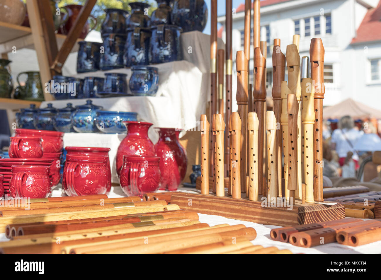 Ceramic mugs and pots, wooden whistles, wooden musical instruments ...