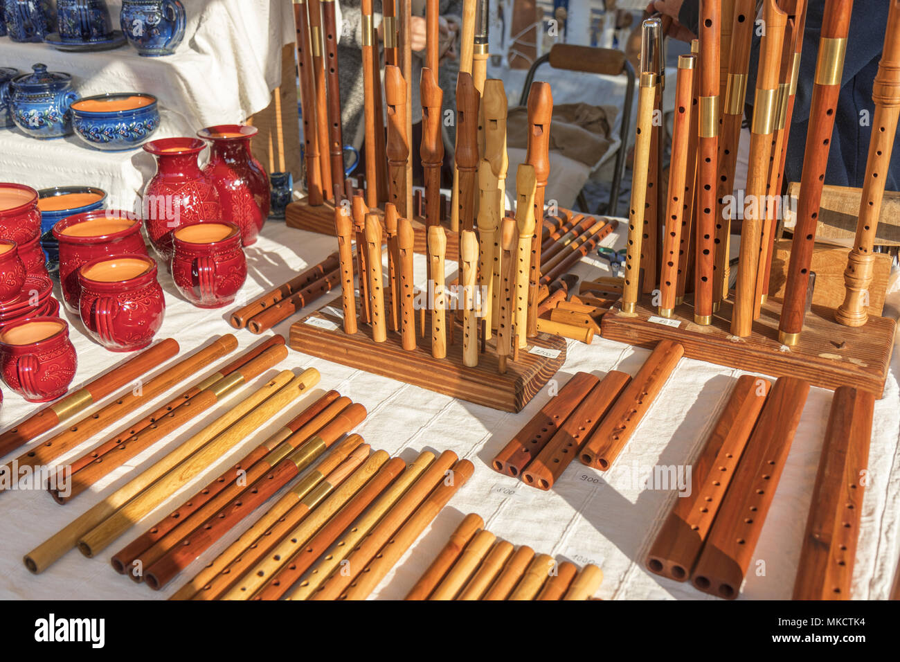 Ceramic mugs and pots, wooden whistles, wooden musical instruments ...