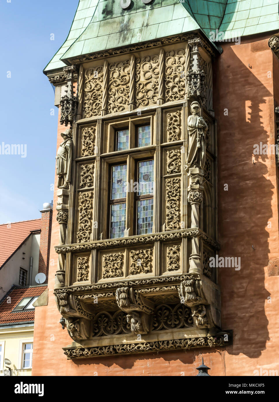 Detail of the facade of the medieval Town Hall. Windows,sculptures ...