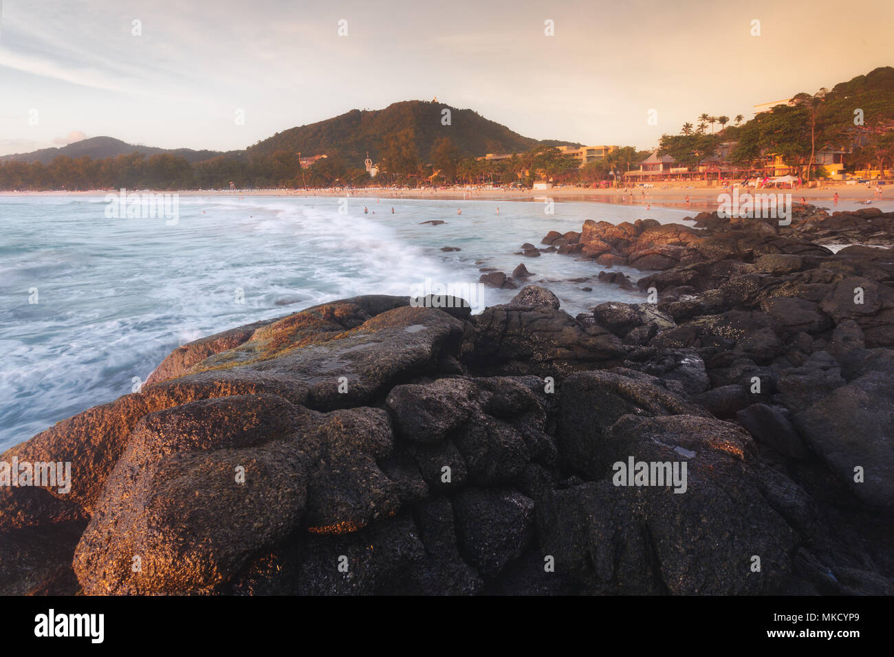 Stones and waves on Kara beach, Phuket, Thailand Stock Photo - Alamy