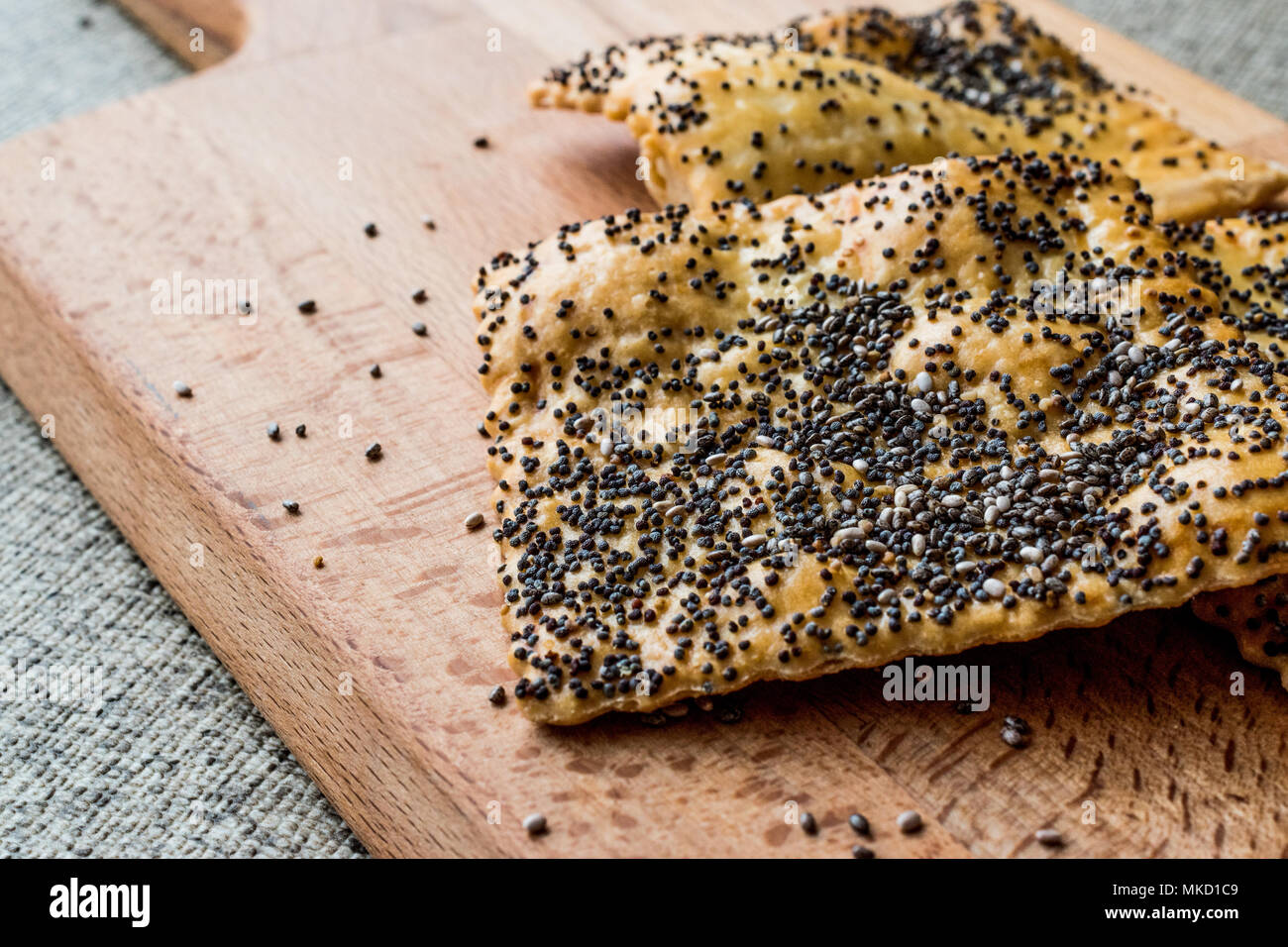 Crispbread with chia seeds and sesame on wooden surface. Organic Snacks ...