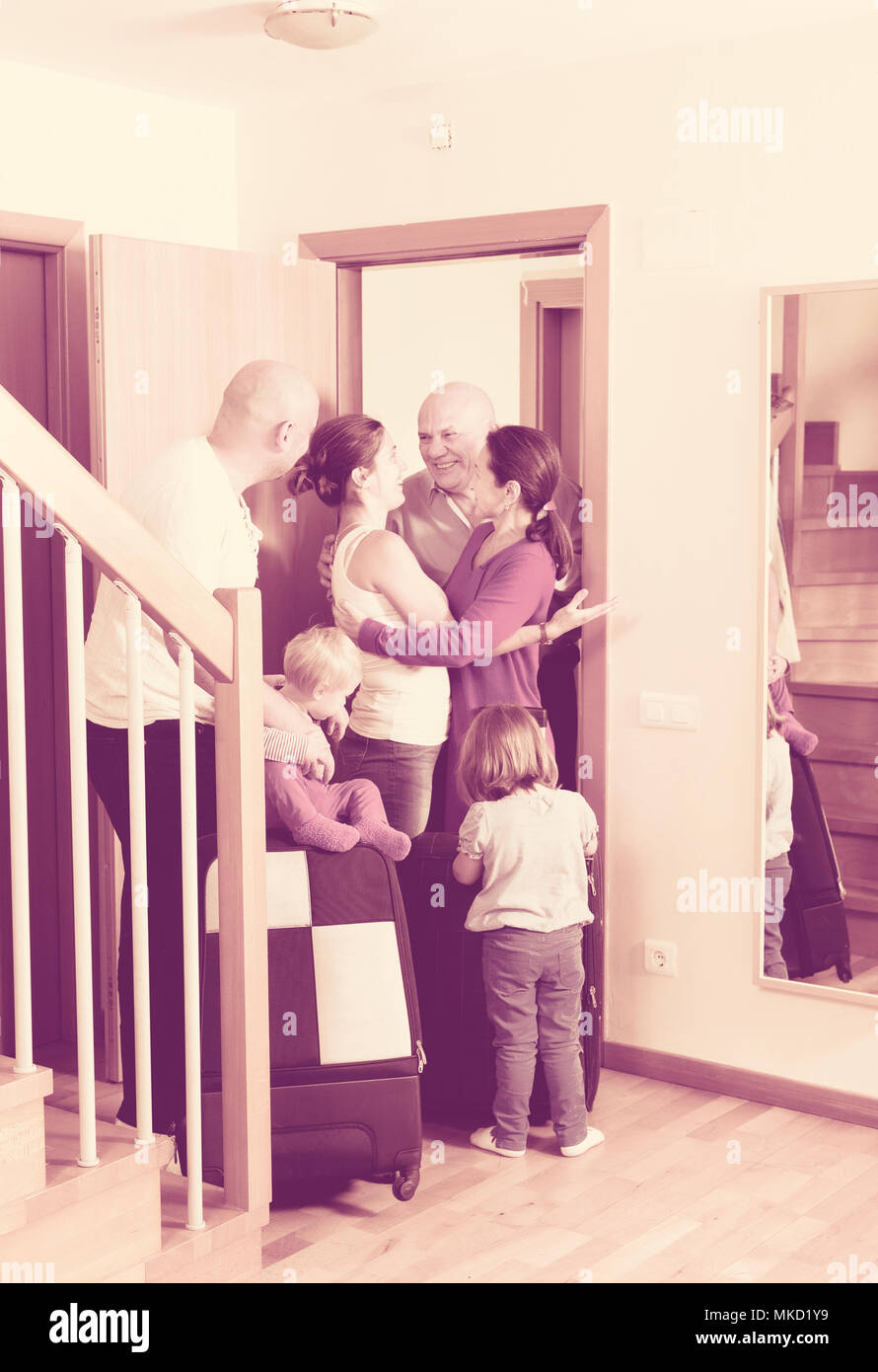 Happy family seeing off the relatives to home Stock Photo - Alamy