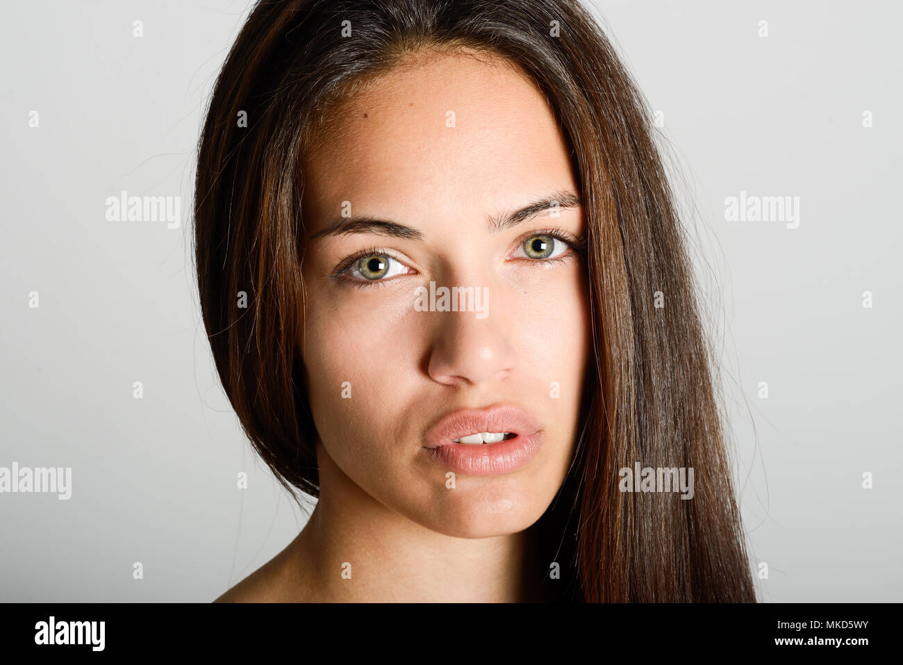 Beautiful young woman without make-up. Beautiful girl with green eyes ...