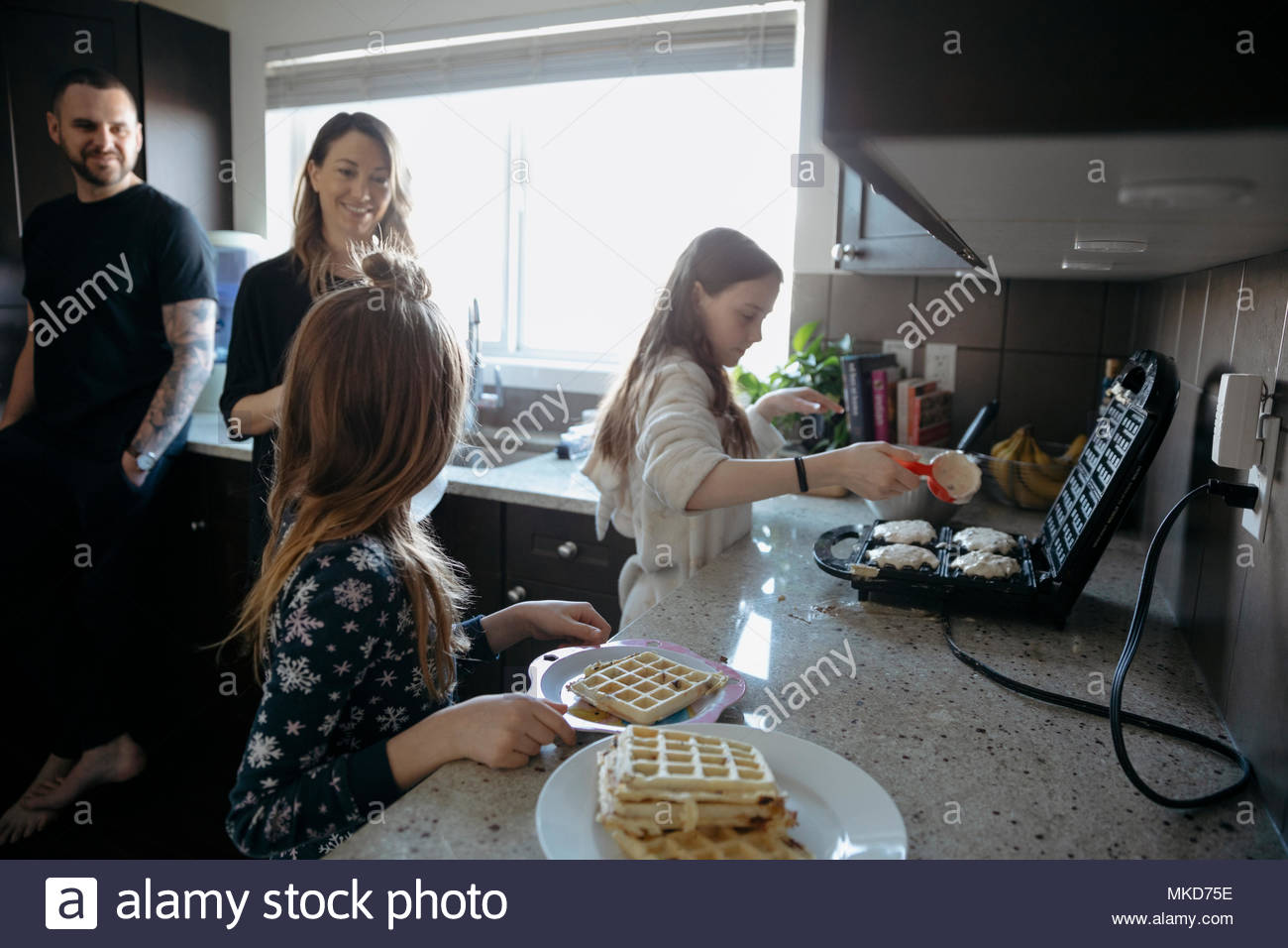 Family mother making breakfast children hi-res stock photography and ...