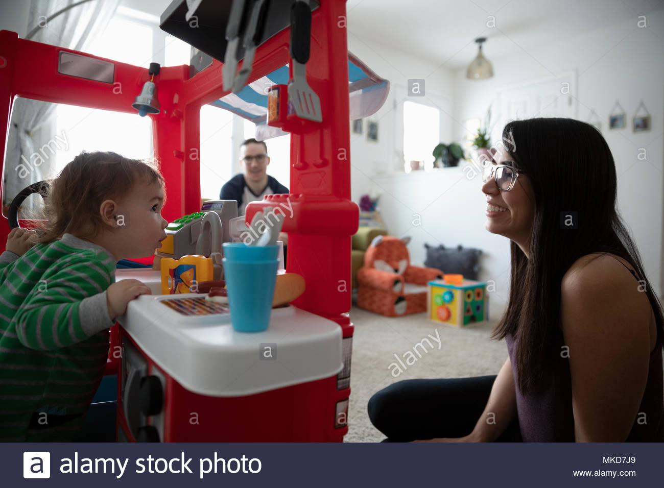 Child playing parent watching hi-res stock photography and images - Alamy