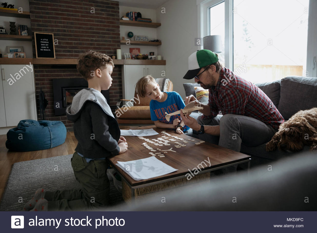 Son showing model airplane hi-res stock photography and images - Alamy