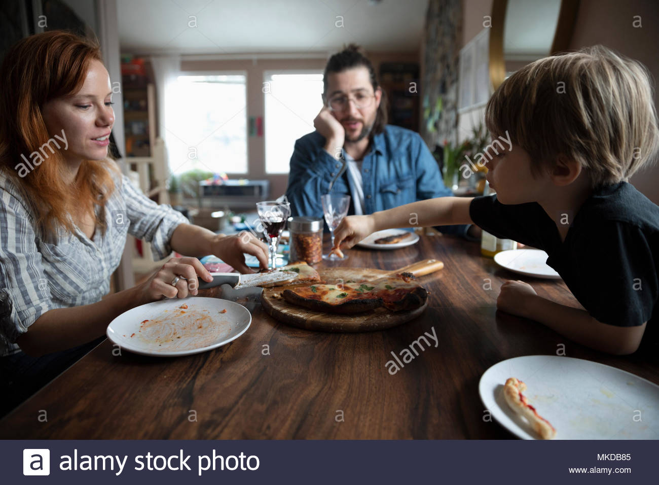 Man eating pizza pointing hi-res stock photography and images - Alamy