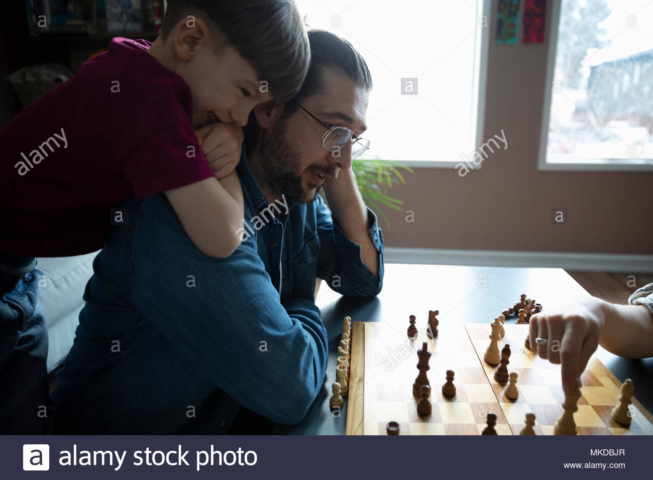 Boy playing chess with his dad hi-res stock photography and images - Alamy