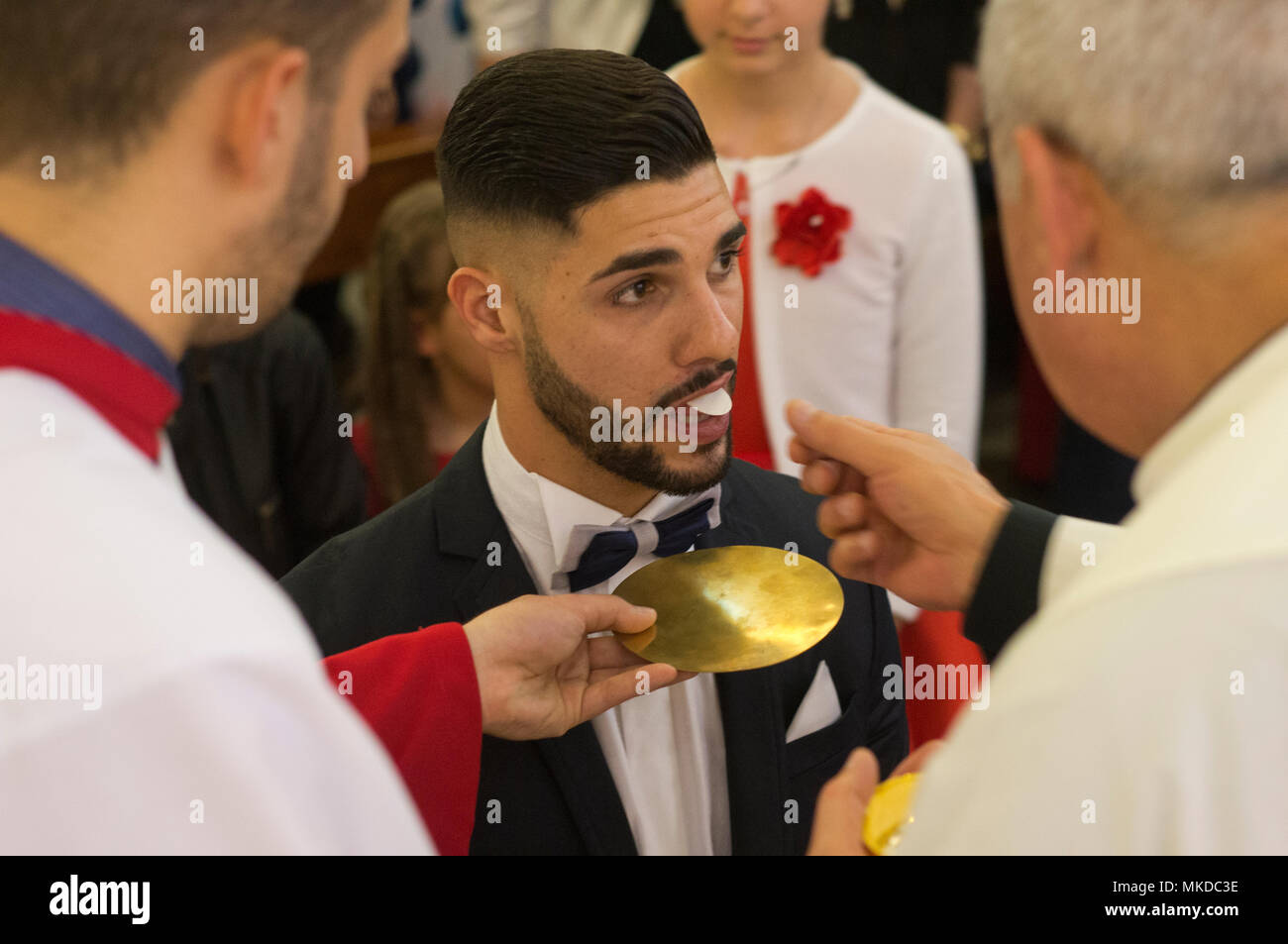 Man getting Holy Communion in Catholic church Palermo, Sicily, Italy ...