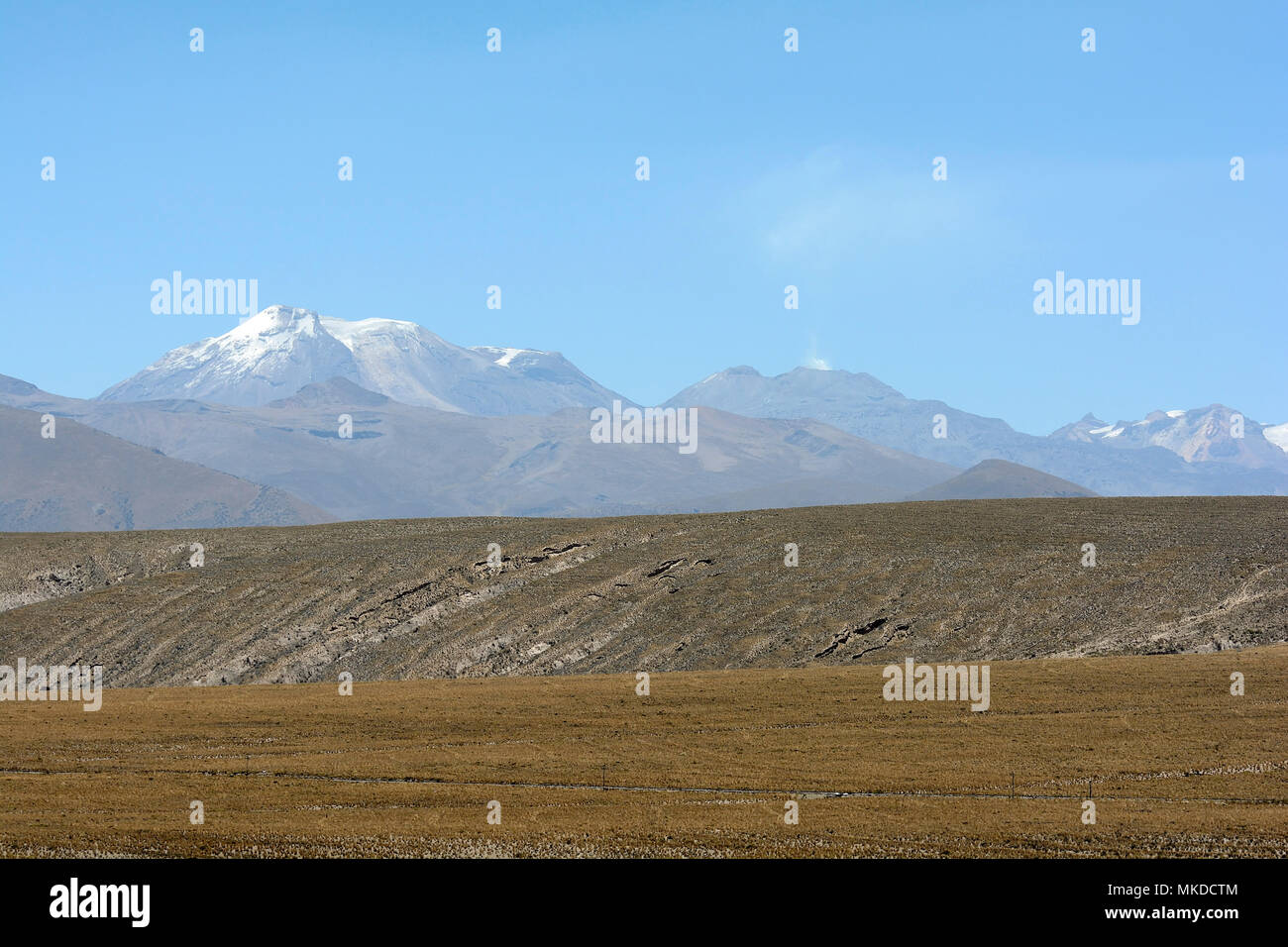 Massive Ampato and Sabancaya volcanoes, seen from the altiplano around ...