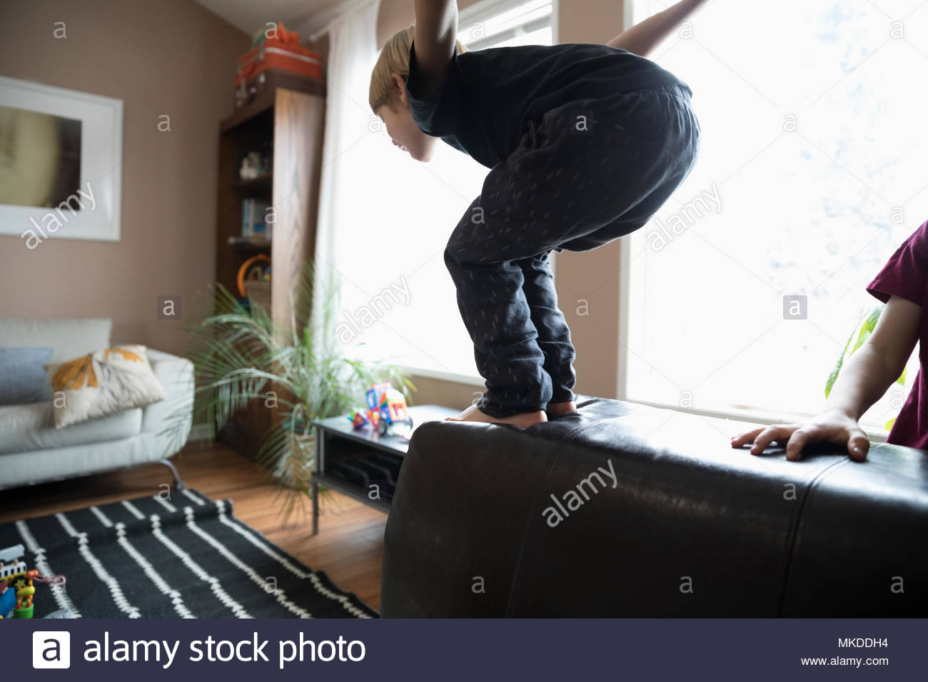Boy barefoot jumping hi-res stock photography and images - Alamy
