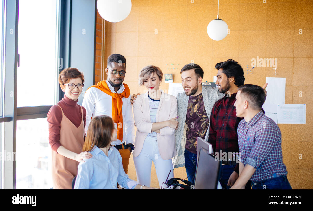 well-cooperating team. hospitable united young people with common goal ...